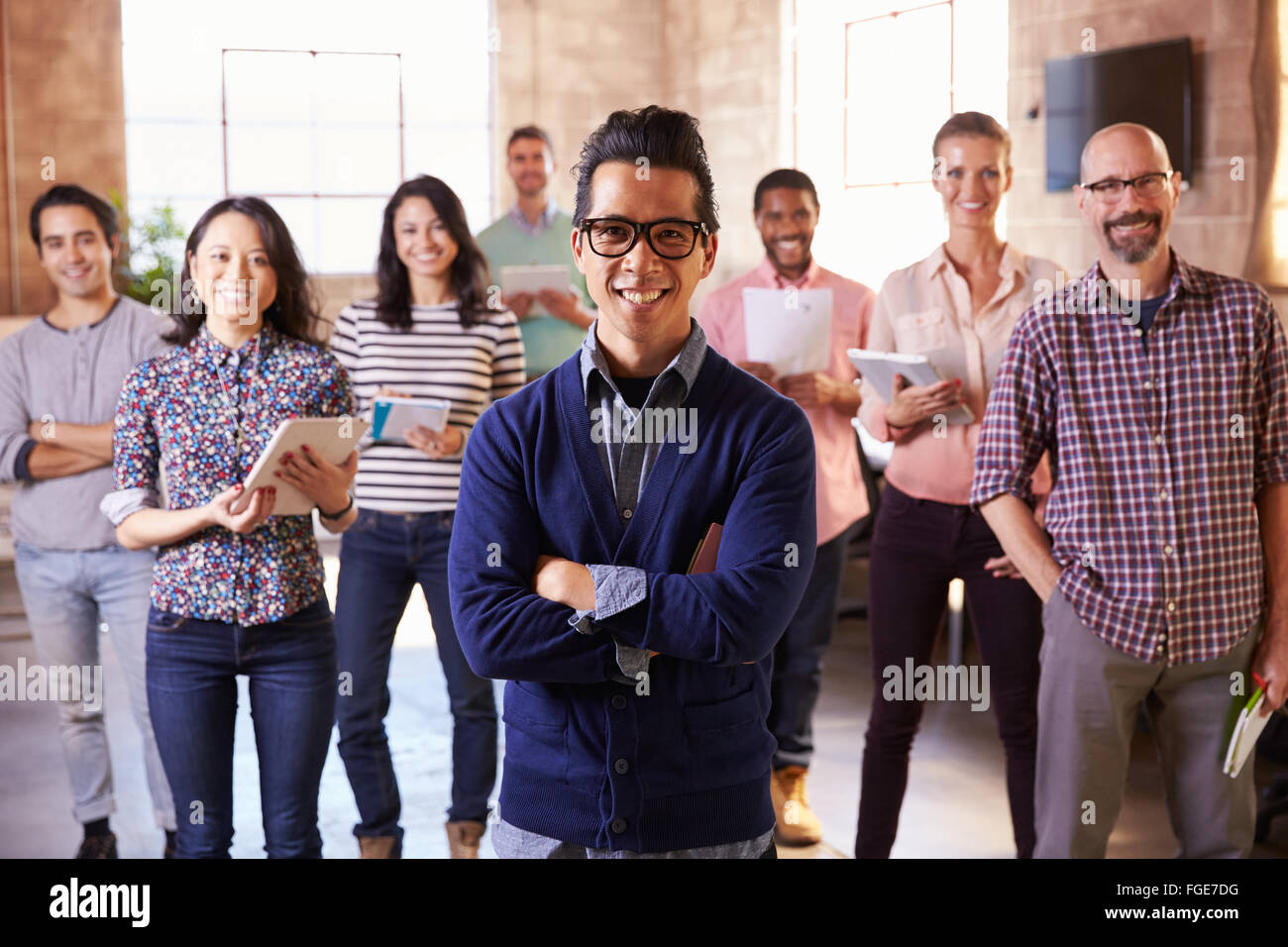 Portrait Of Staff Standing In Modern Design Office Stock Photo - Alamy