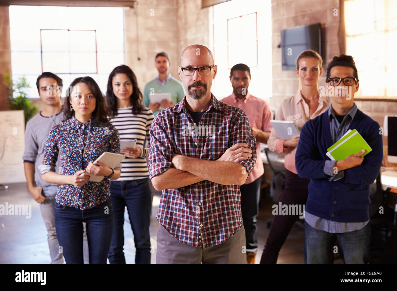 Portrait Of Staff Standing In Modern Design Office Stock Photo - Alamy