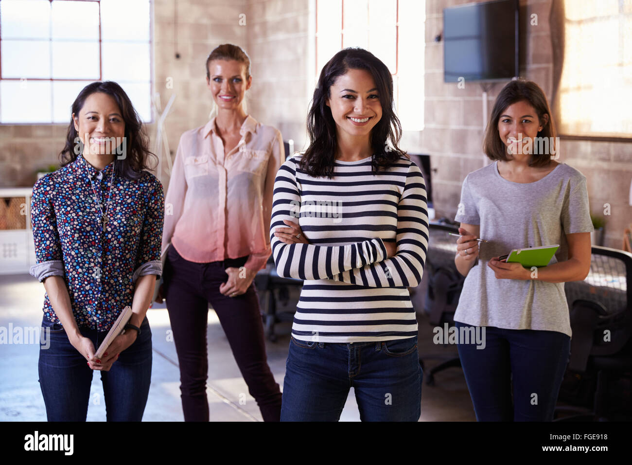 Portrait Of Female Staff Standing In Modern Design Office Stock Photo ...