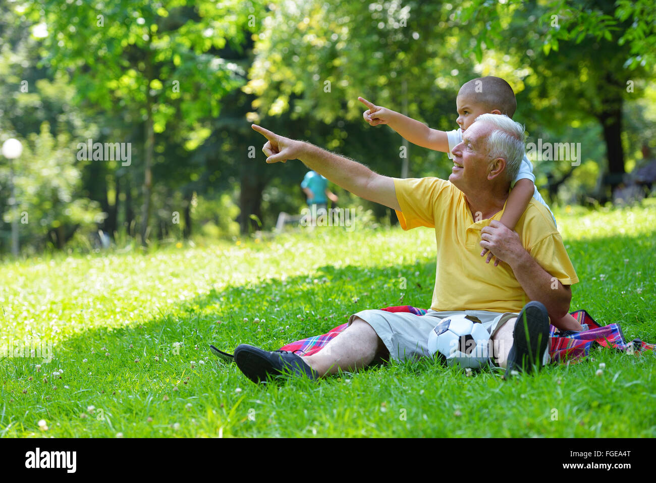 happy grandfather and child in park Stock Photo - Alamy