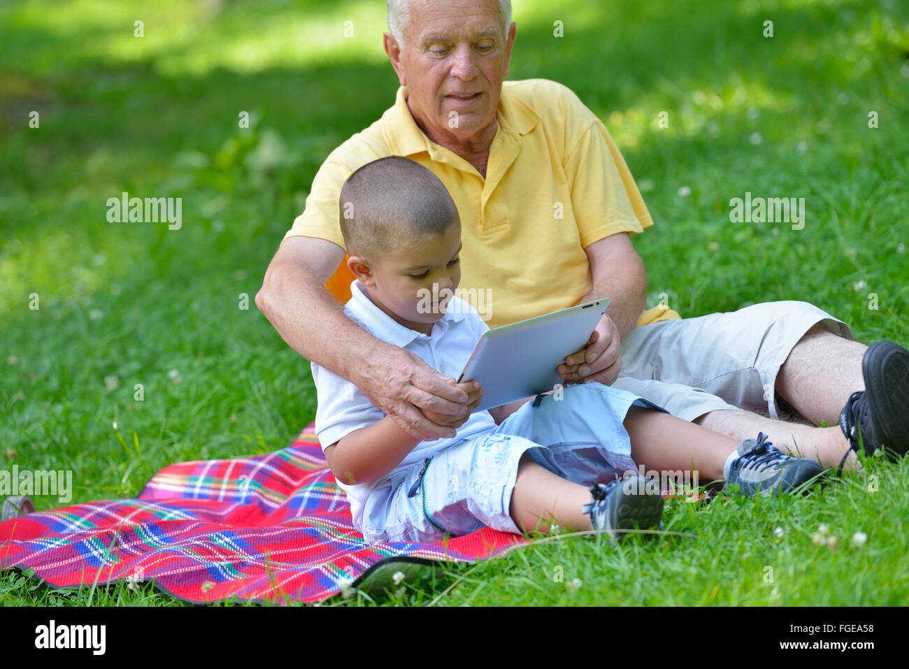 happy grandfather and child in park Stock Photo - Alamy