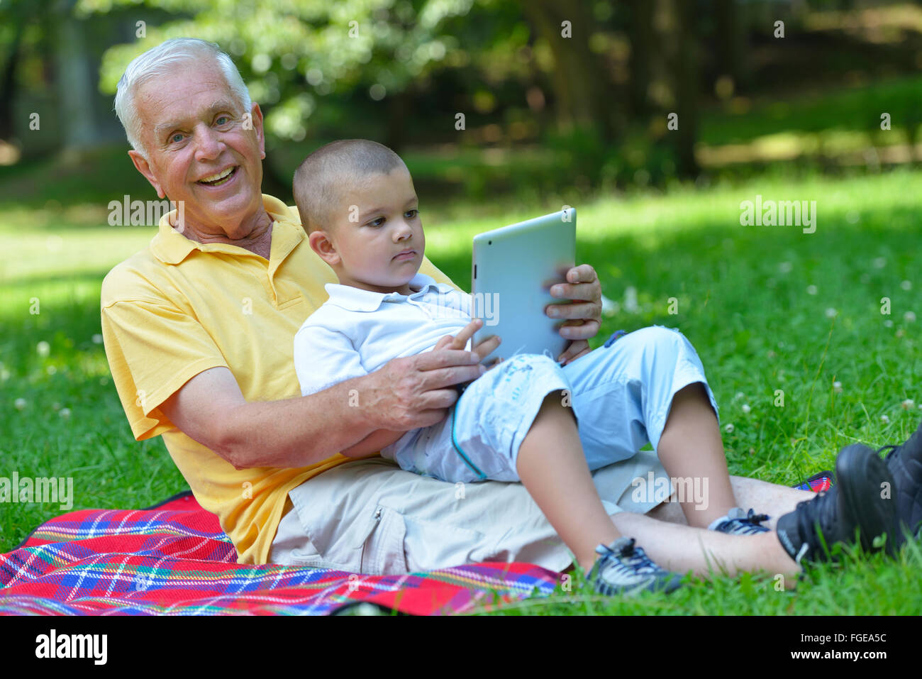 Old man child technology hi-res stock photography and images - Alamy