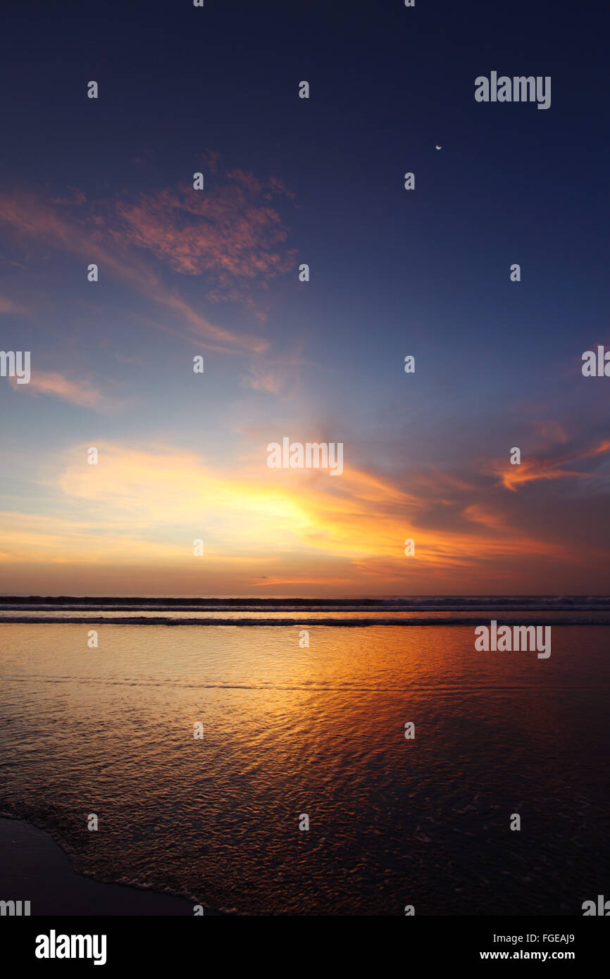 Radiant sea beach sunset on Bali Stock Photo - Alamy