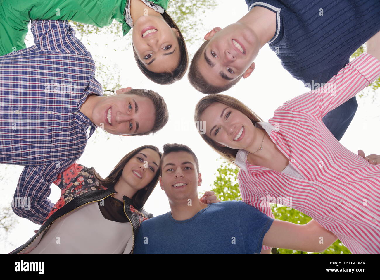 young friends staying together outdoor in the park Stock Photo - Alamy