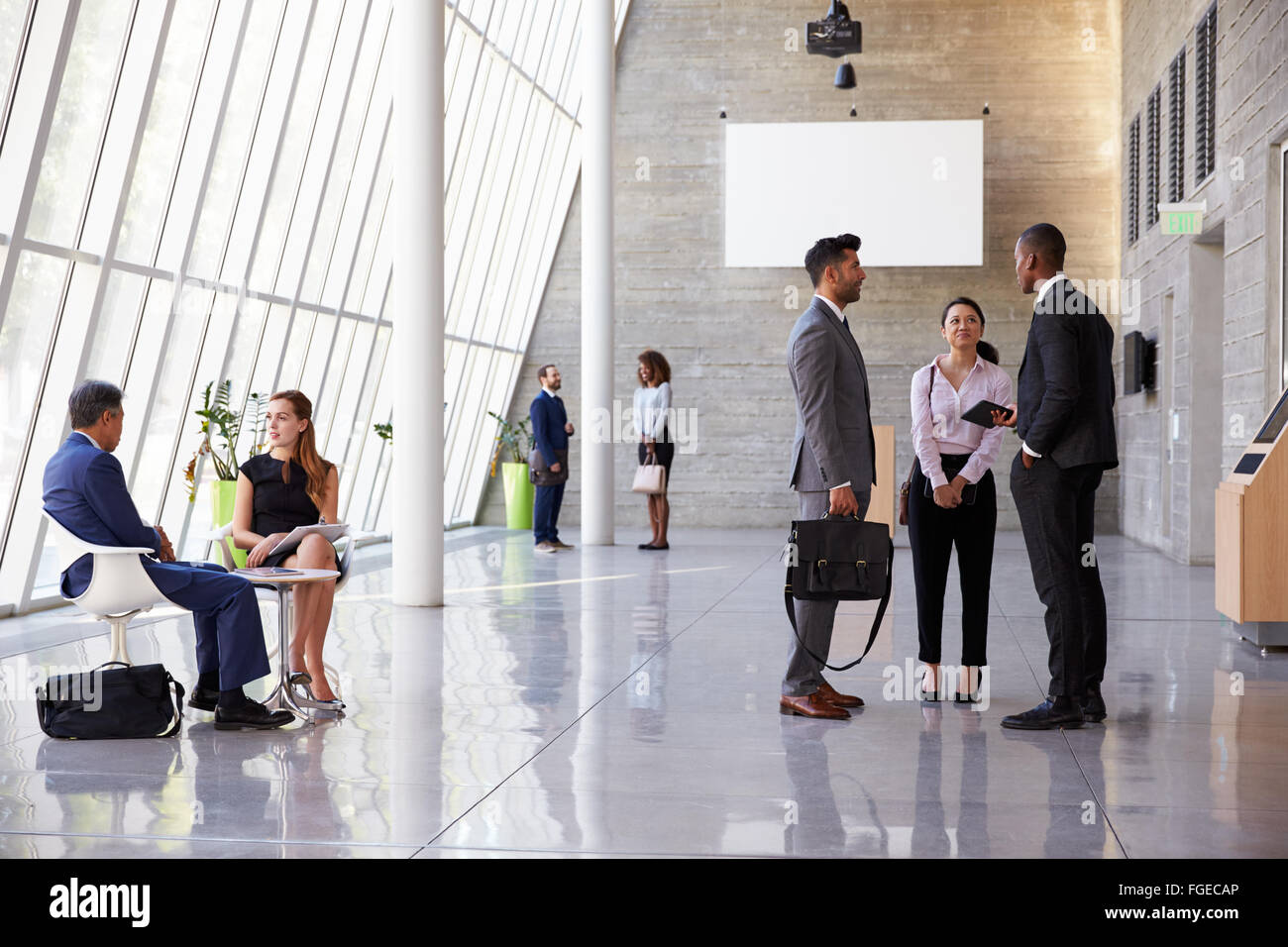 Interior Of Busy Office Foyer Area With Businesspeople Stock Photo - Alamy