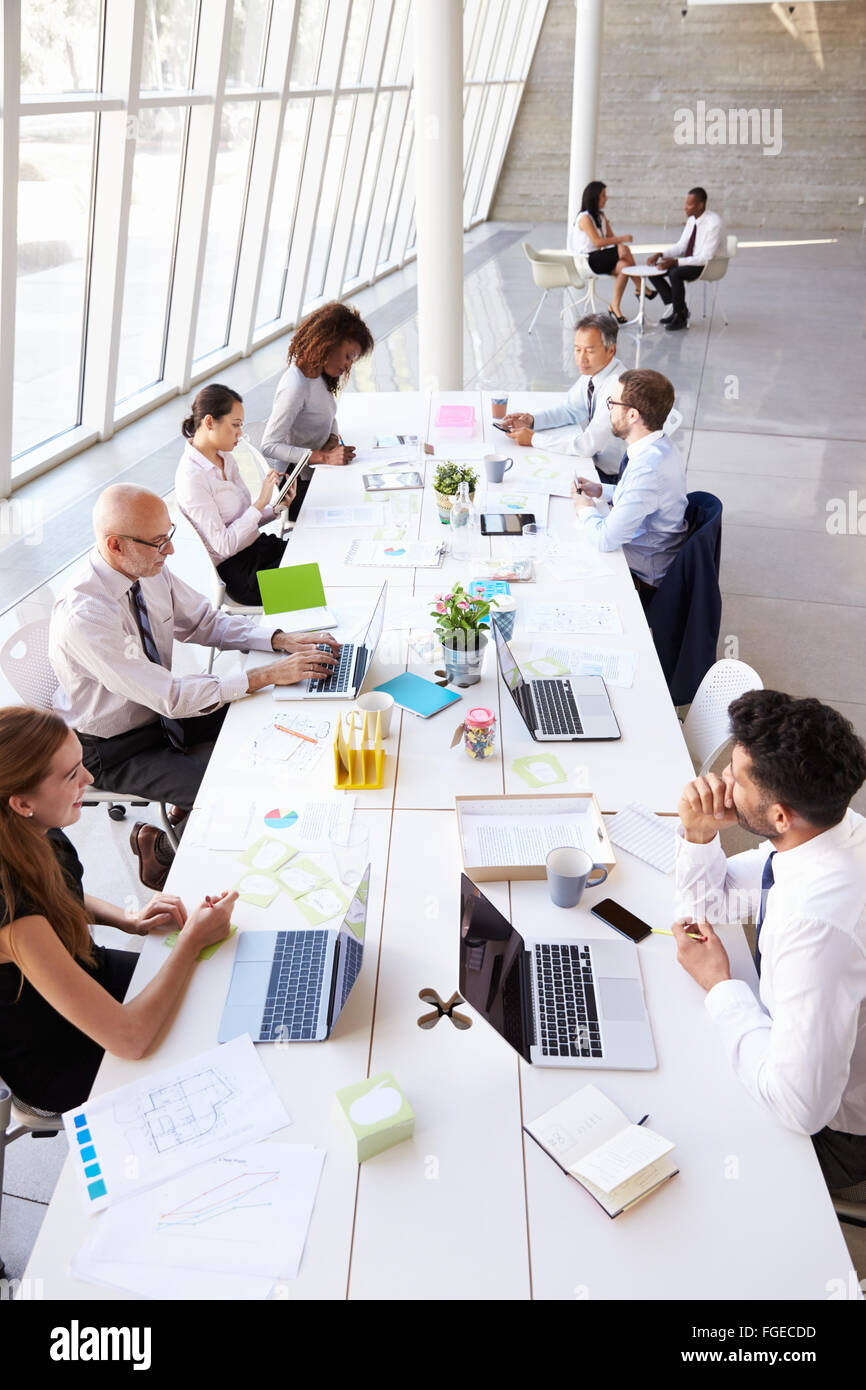 Overhead View Of Business Meeting Around Boardroom Table Stock Photo ...