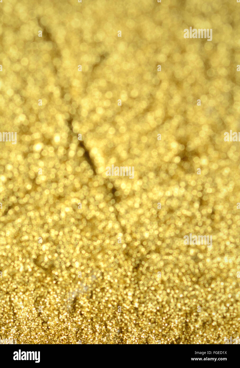 Abstract golden background, shiny gold glitter photographed with a ...