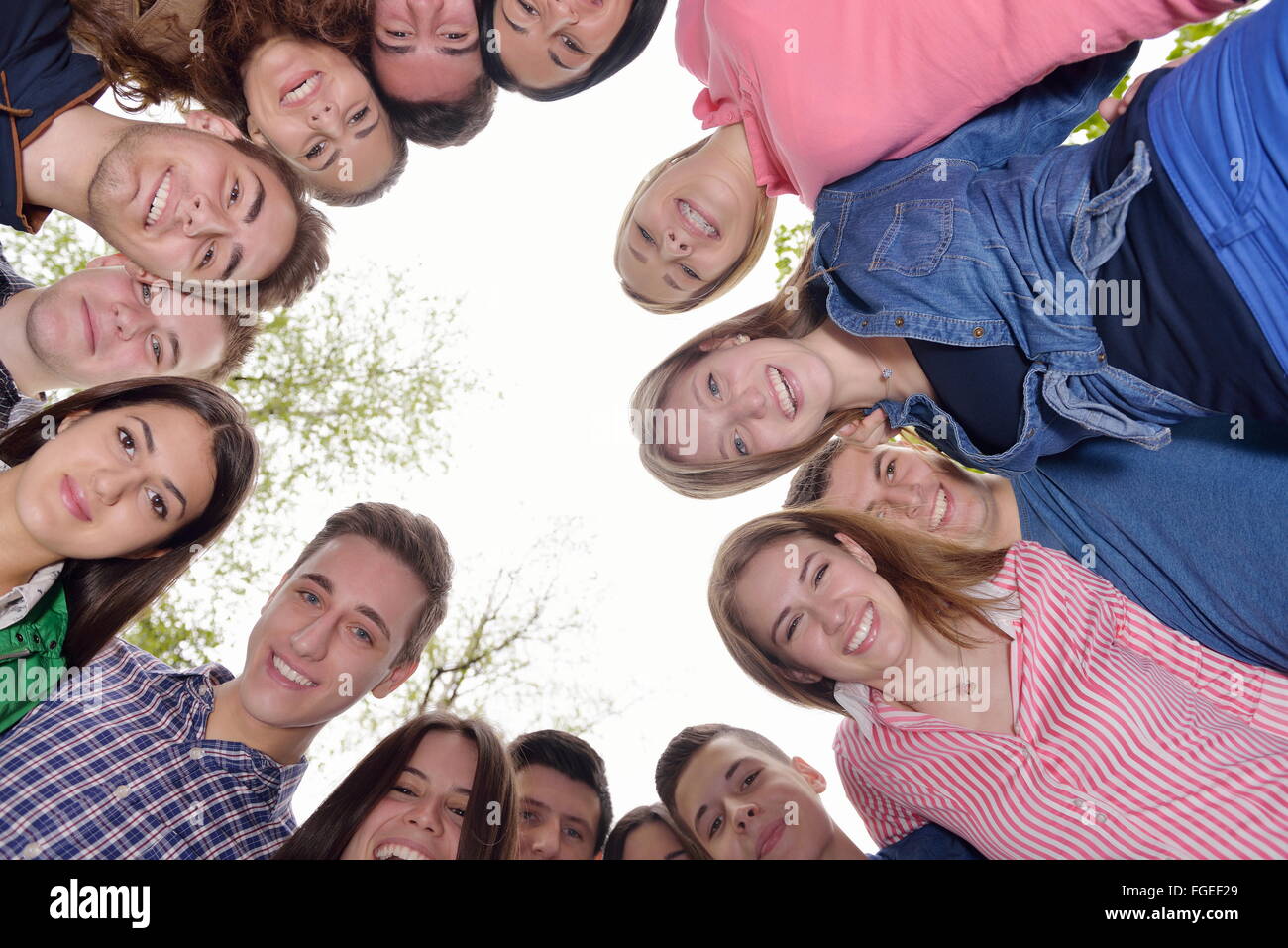 young friends staying together outdoor in the park Stock Photo - Alamy