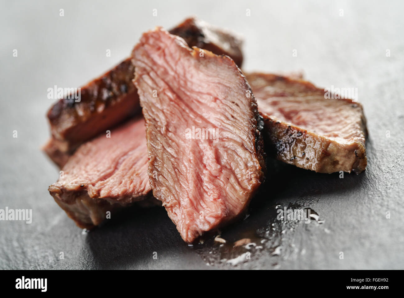 entrecote beef steak sliced on slate board Stock Photo - Alamy