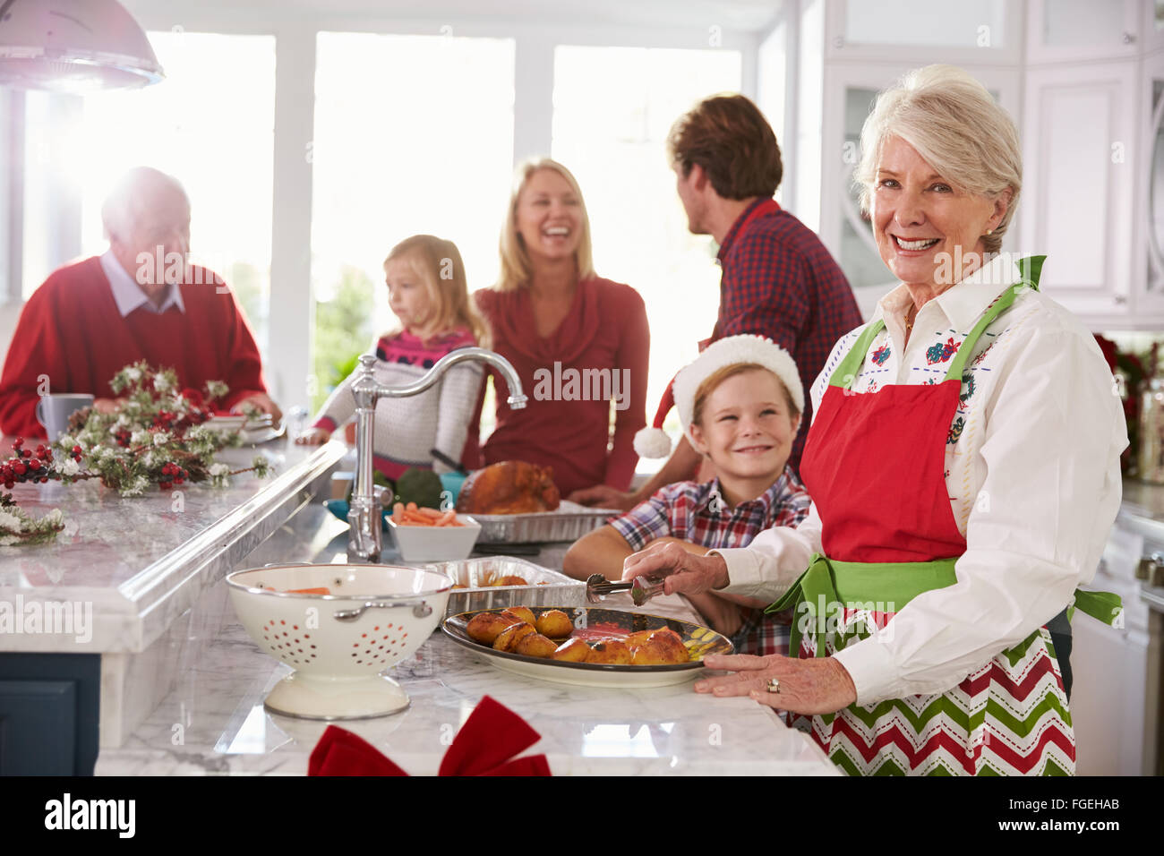 Extended Family Group Preparing Christmas Meal In Kitchen Stock Photo ...