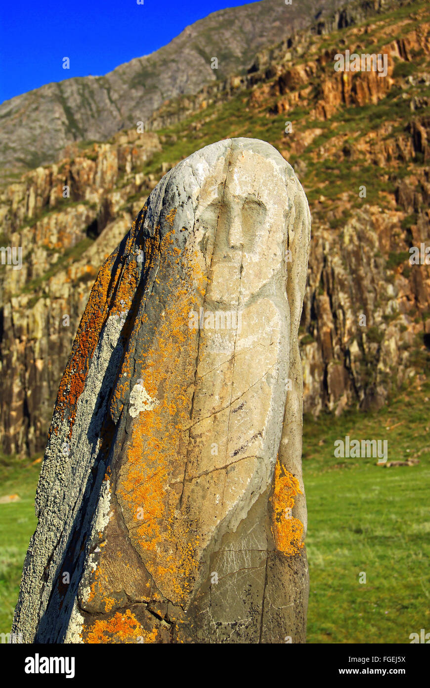 Stone guard warrior ancient rock with the man`s face ritual prehistoric ...