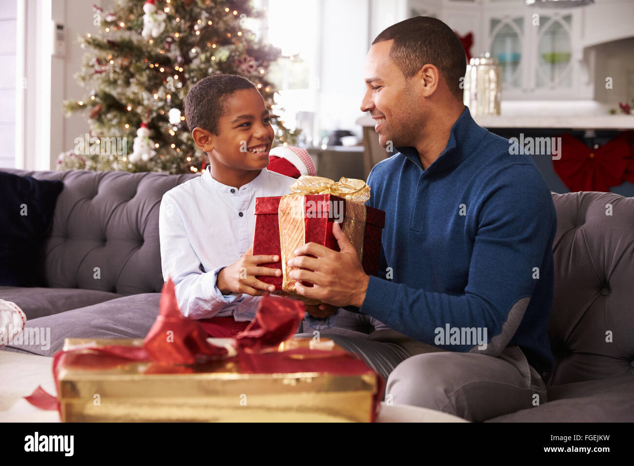 African boy opening gift hi-res stock photography and images - Alamy