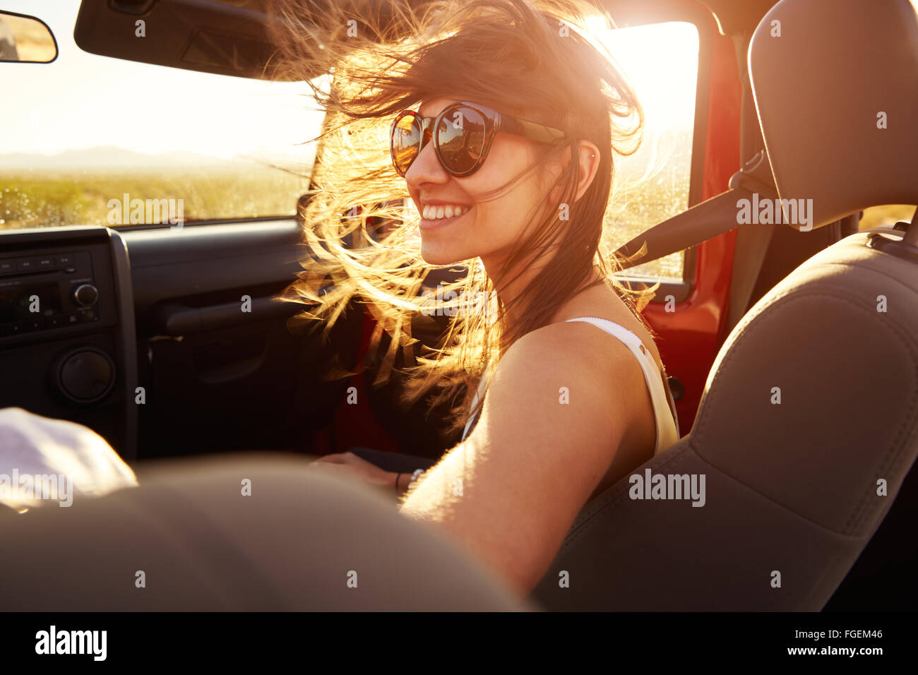 Woman Passenger On Road Trip In Convertible Car Stock Photo - Alamy