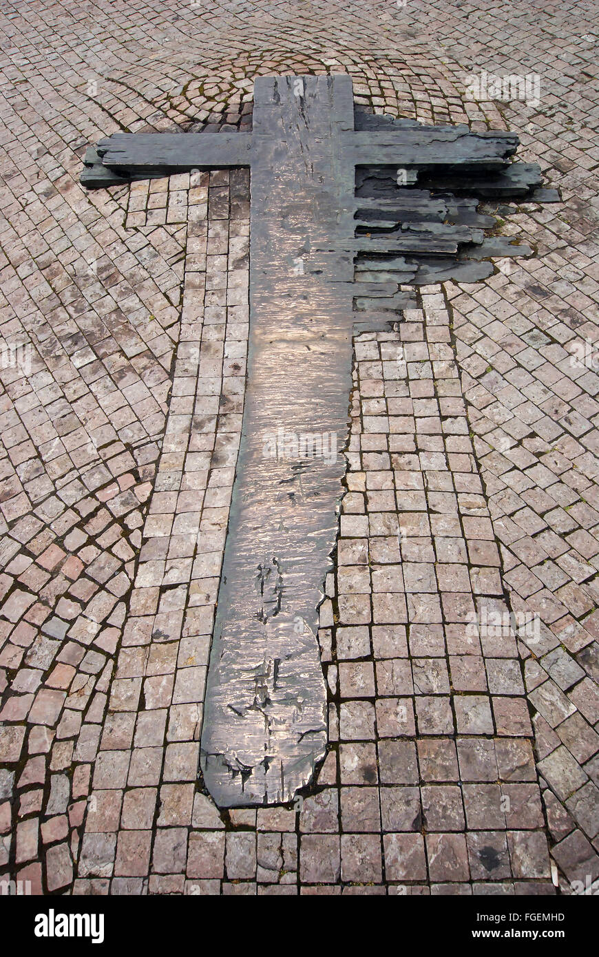 Memorial bronze metal cross paving stone on pavement Stock Photo - Alamy