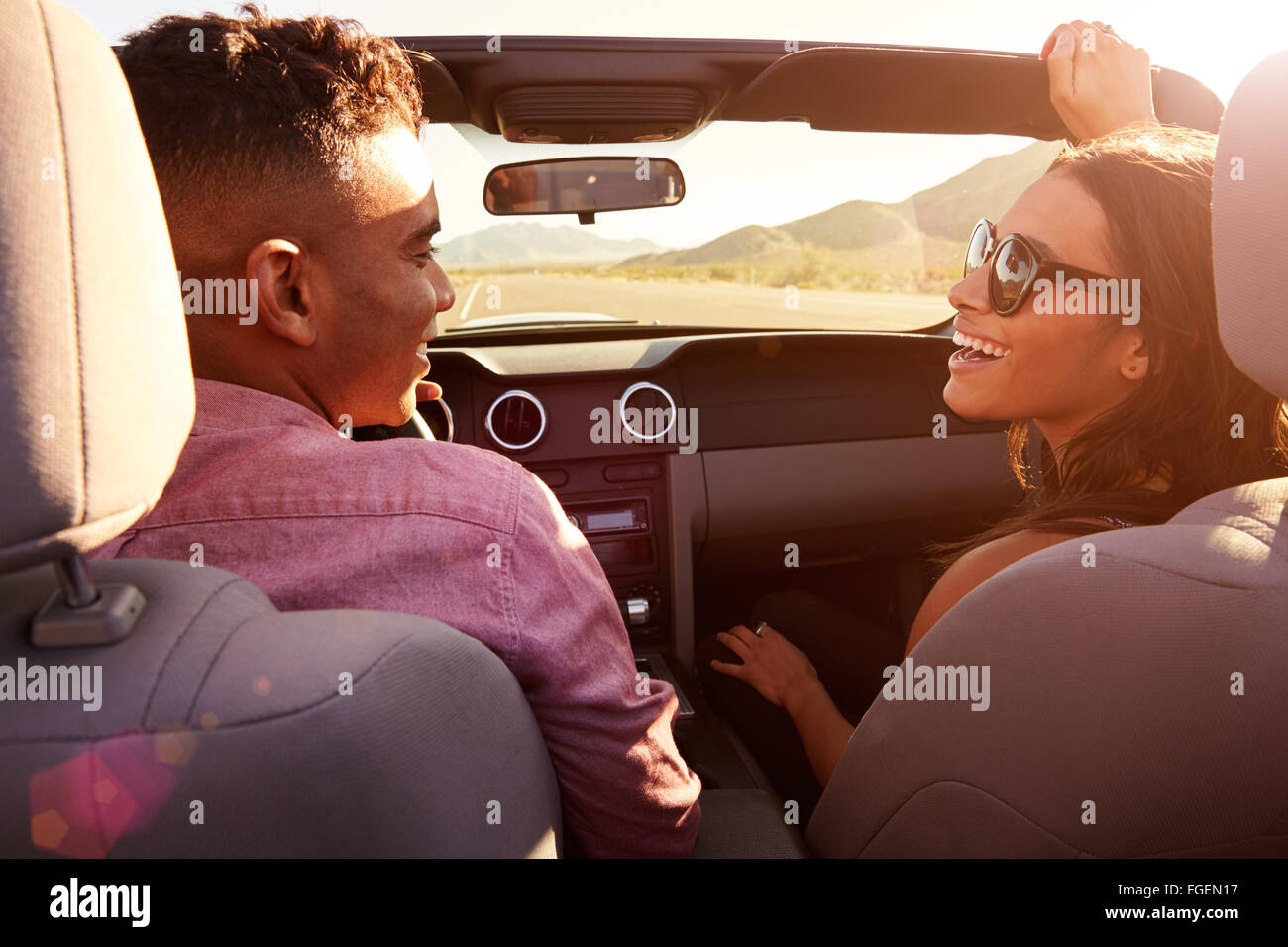 Couple On Road Trip Driving In Convertible Car Stock Photo - Alamy