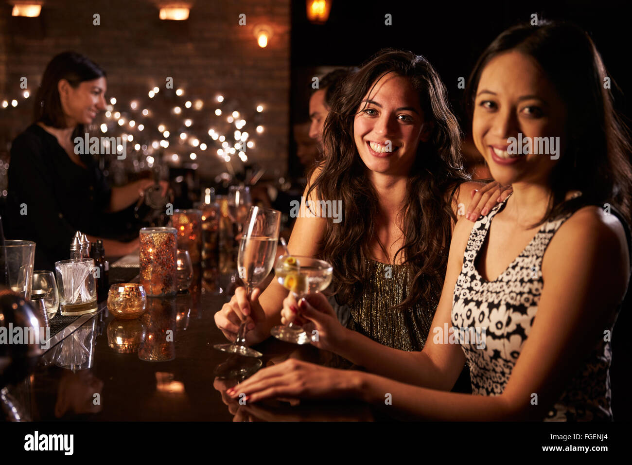 Portrait Of Female Friends On Night Out At Cocktail Bar Stock Photo - Alamy