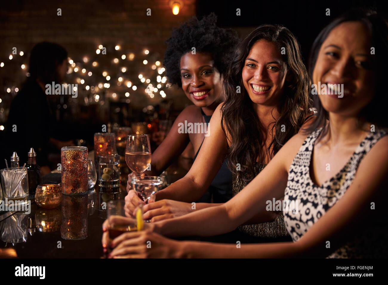 Portrait Of Female Friends On Night Out At Cocktail Bar Stock Photo - Alamy