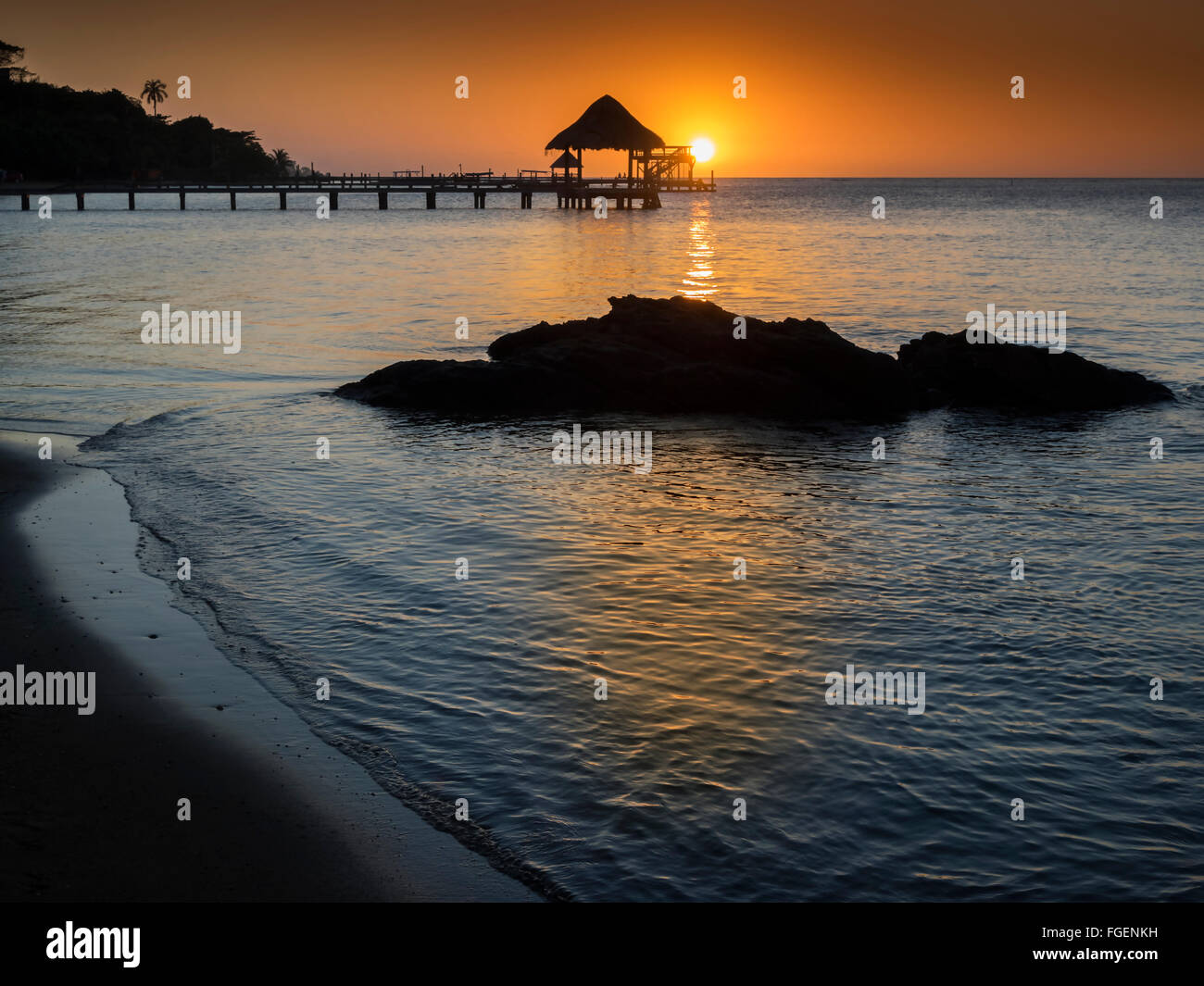 Sunset on the tropical island of Roatan, Honduras Stock Photo - Alamy