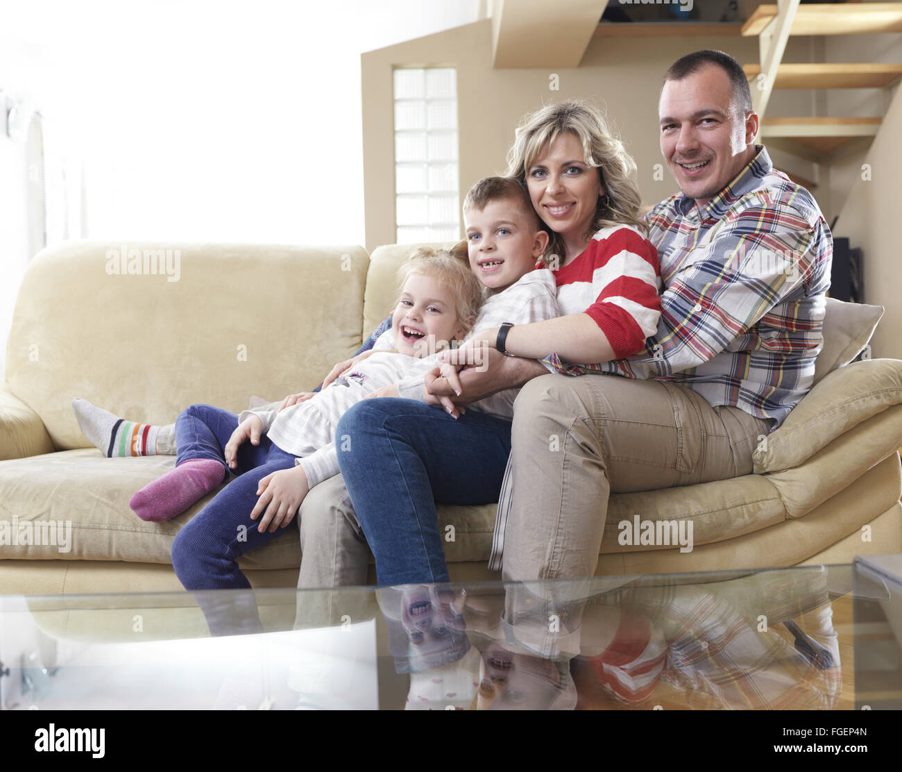 happy young family at home Stock Photo - Alamy