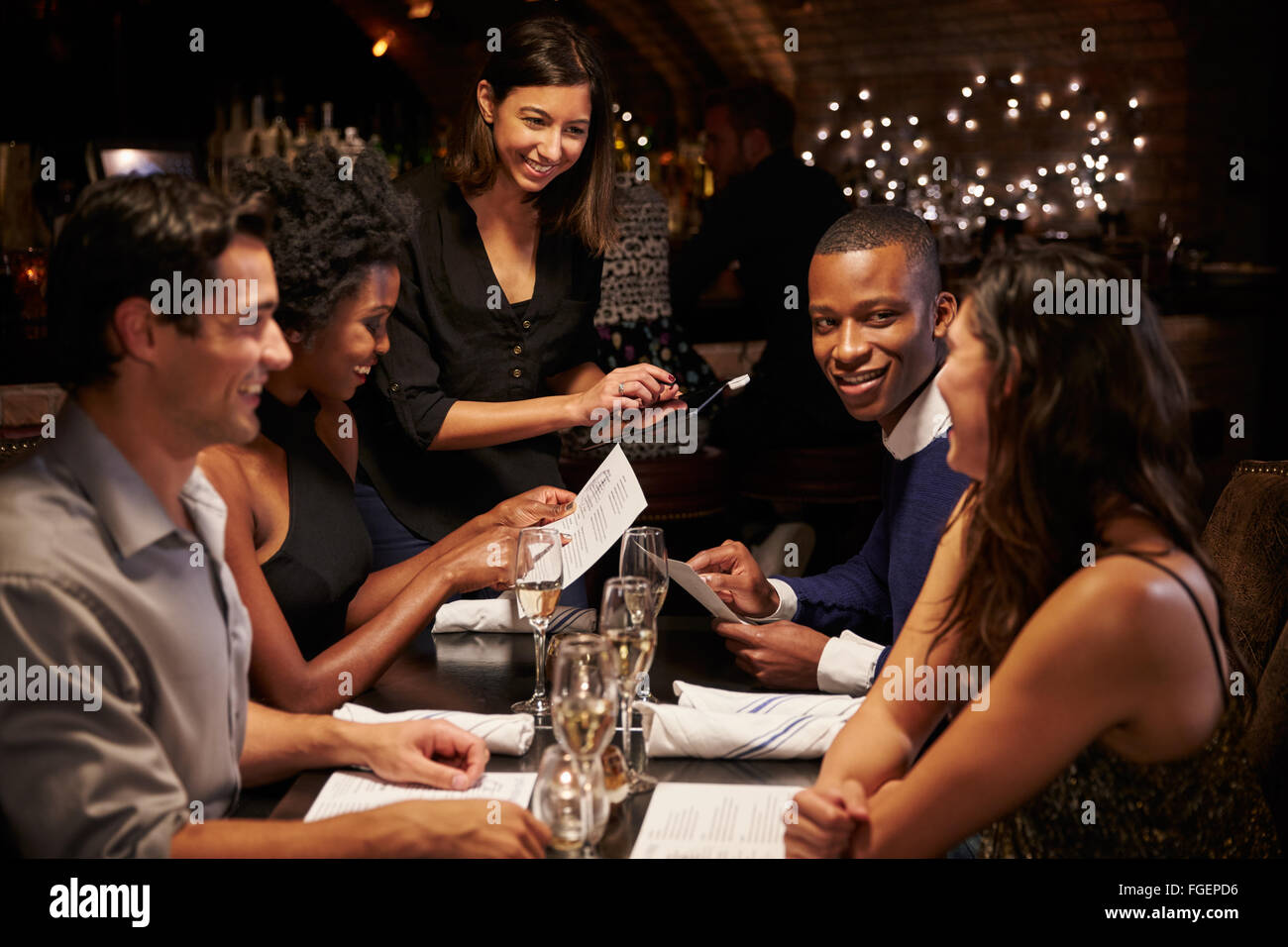 Waitress Takes Order In Restaurant Using Digital Tablet Stock Photo - Alamy