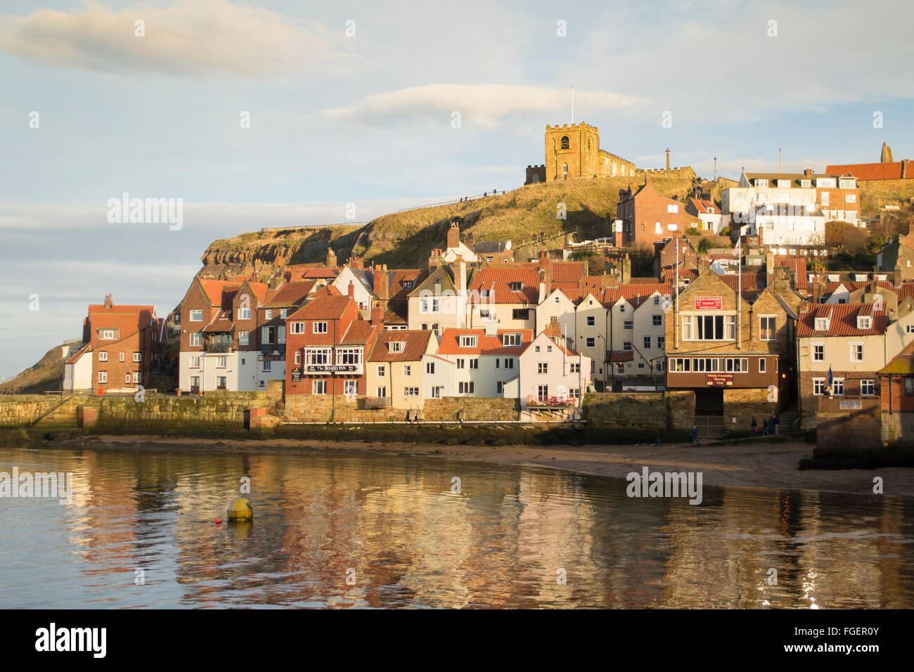 View over Whitby harbour during golden hour. Looking towards old town ...