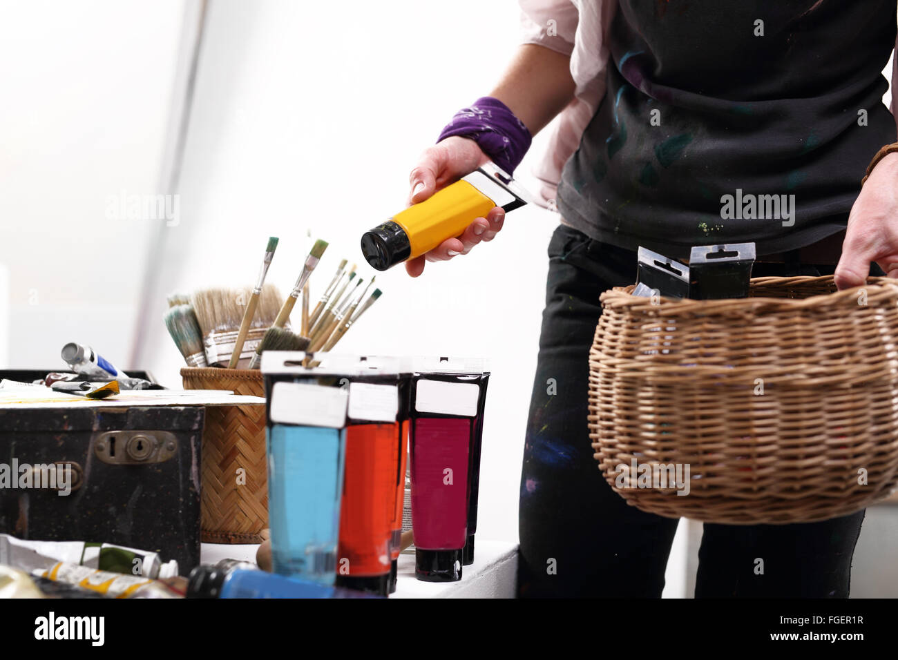 Paint and painting accessories. Colorful paint, a professional painting ...