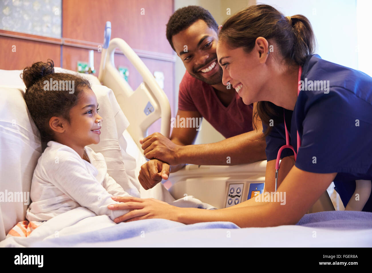 Pediatrician Visiting Father And Child In Hospital Bed Stock Photo - Alamy