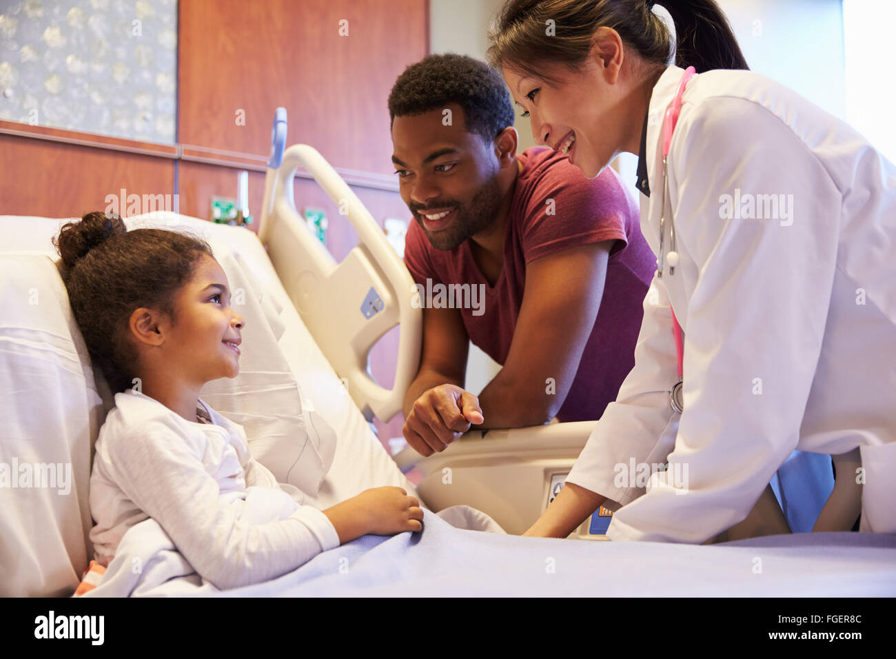 Pediatrician Visiting Father And Child In Hospital Bed Stock Photo - Alamy