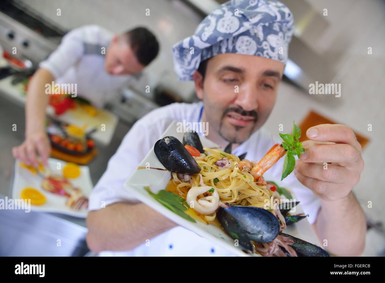 Male chef preparing pasta hi-res stock photography and images - Alamy