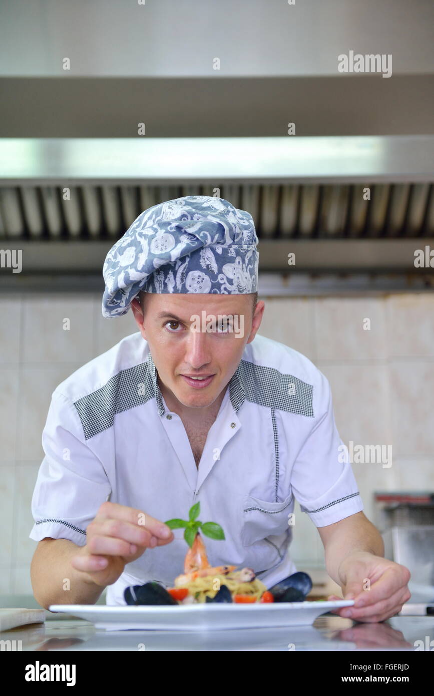 Happy chef preparing pasta hi-res stock photography and images - Alamy