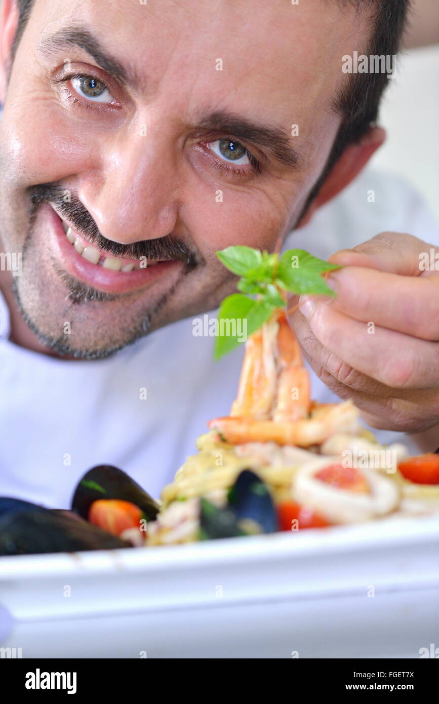 Male chef preparing pasta hi-res stock photography and images - Alamy