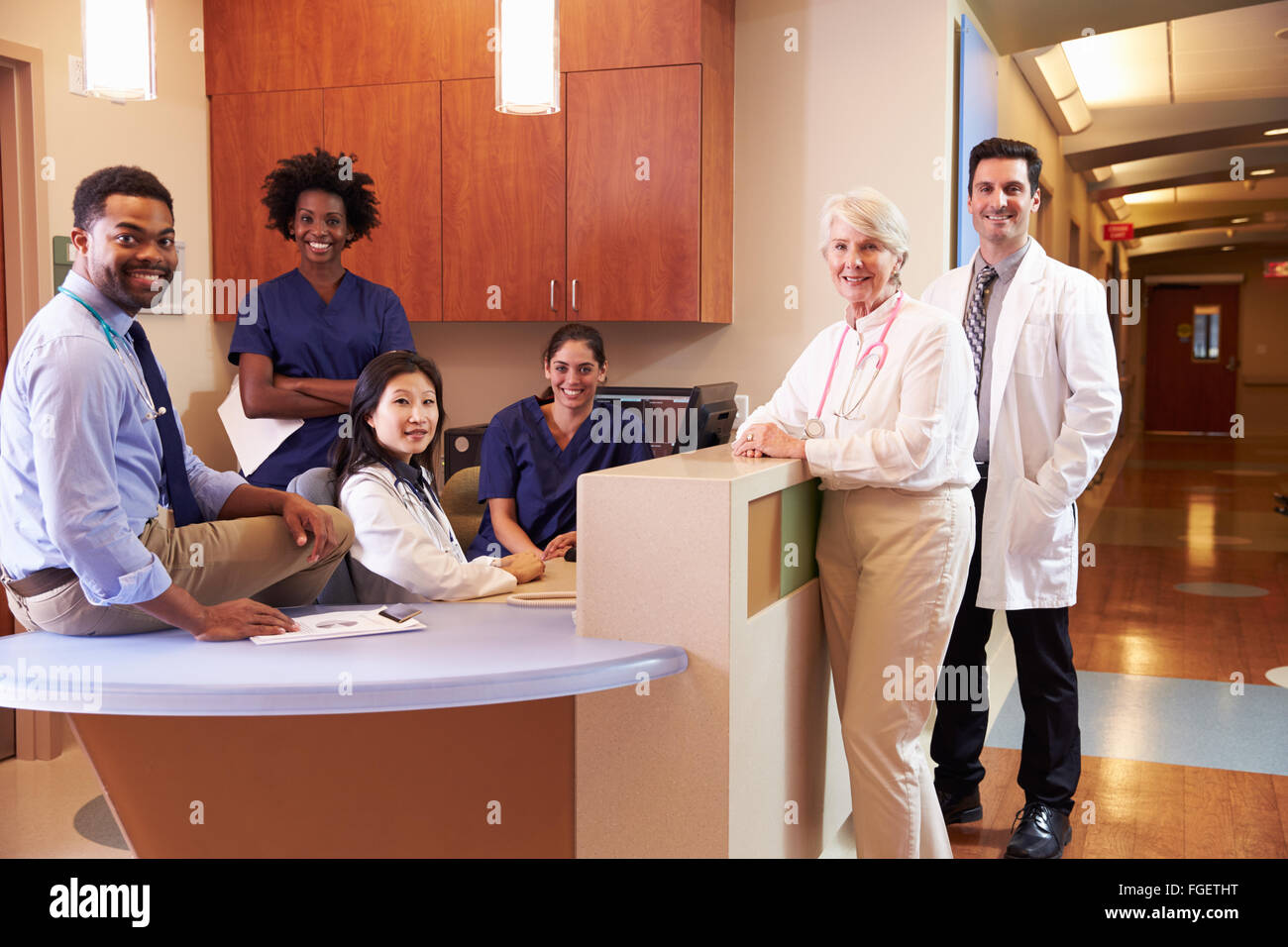 Portrait Of Medical Staff At Nurse's Station In Hospital Stock Photo ...