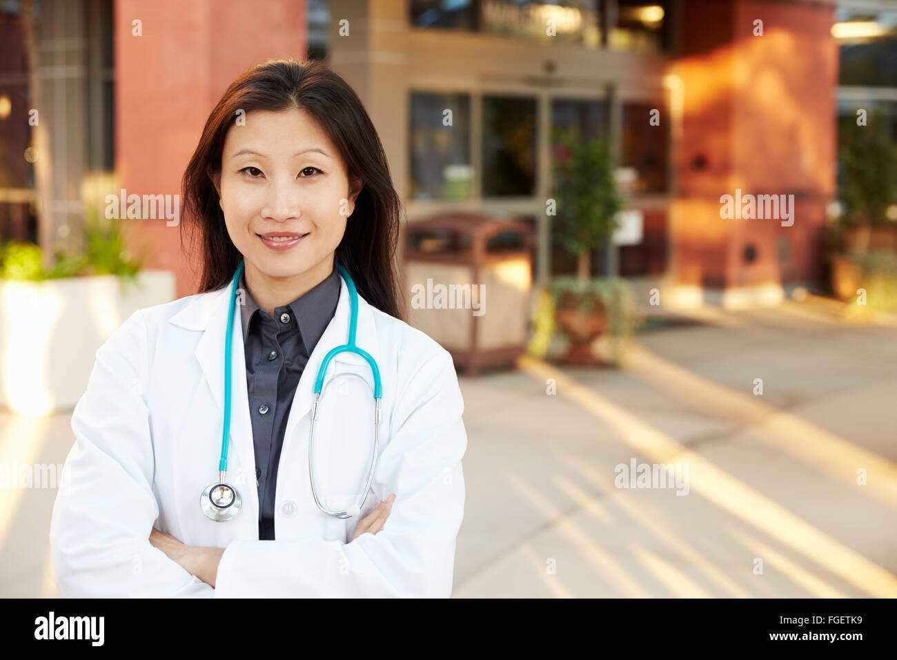 Portrait Of Female Doctor Standing Outside Hospital Stock Photo - Alamy