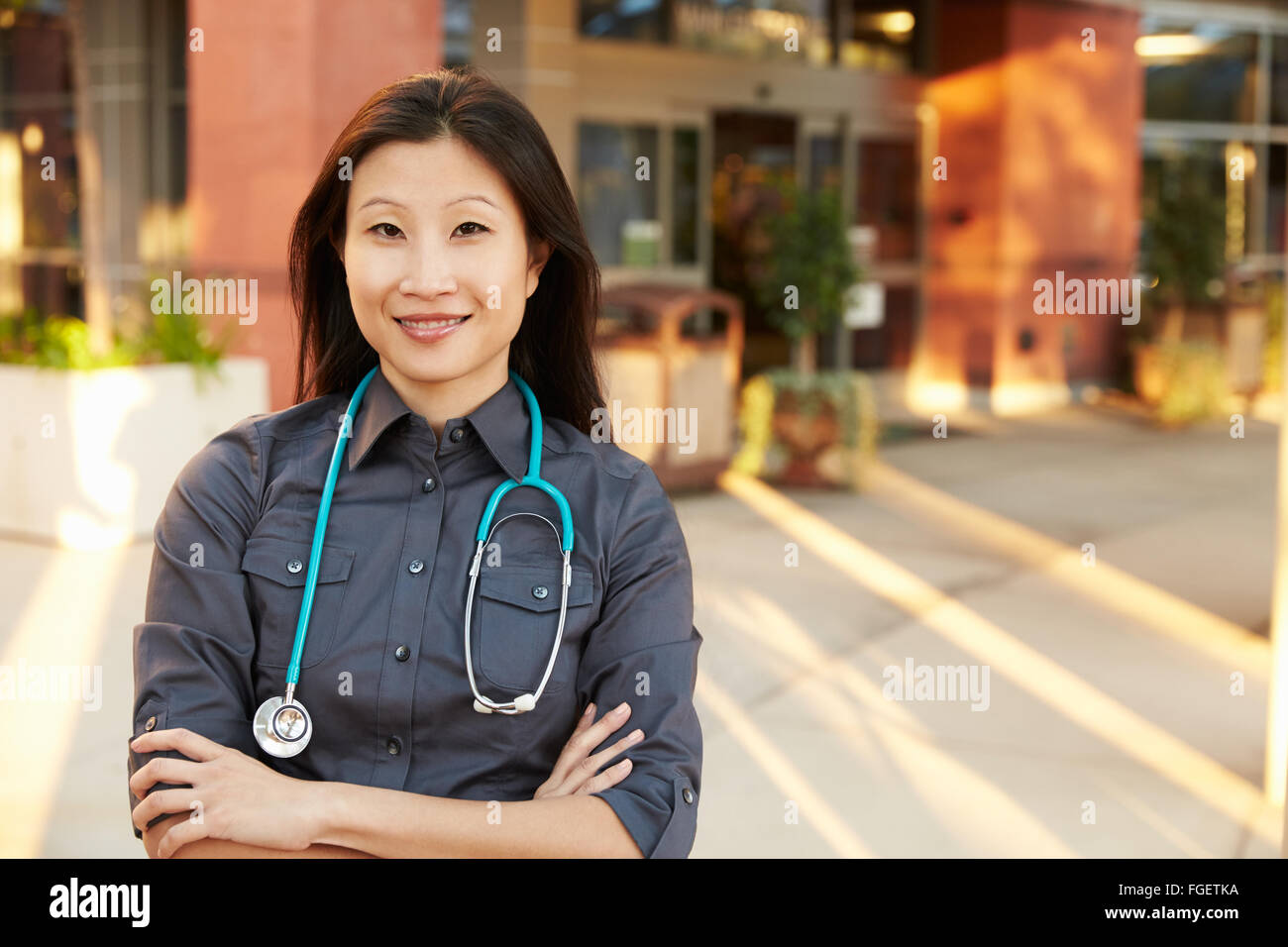 Portrait Of Female Doctor Standing Outside Hospital Stock Photo - Alamy