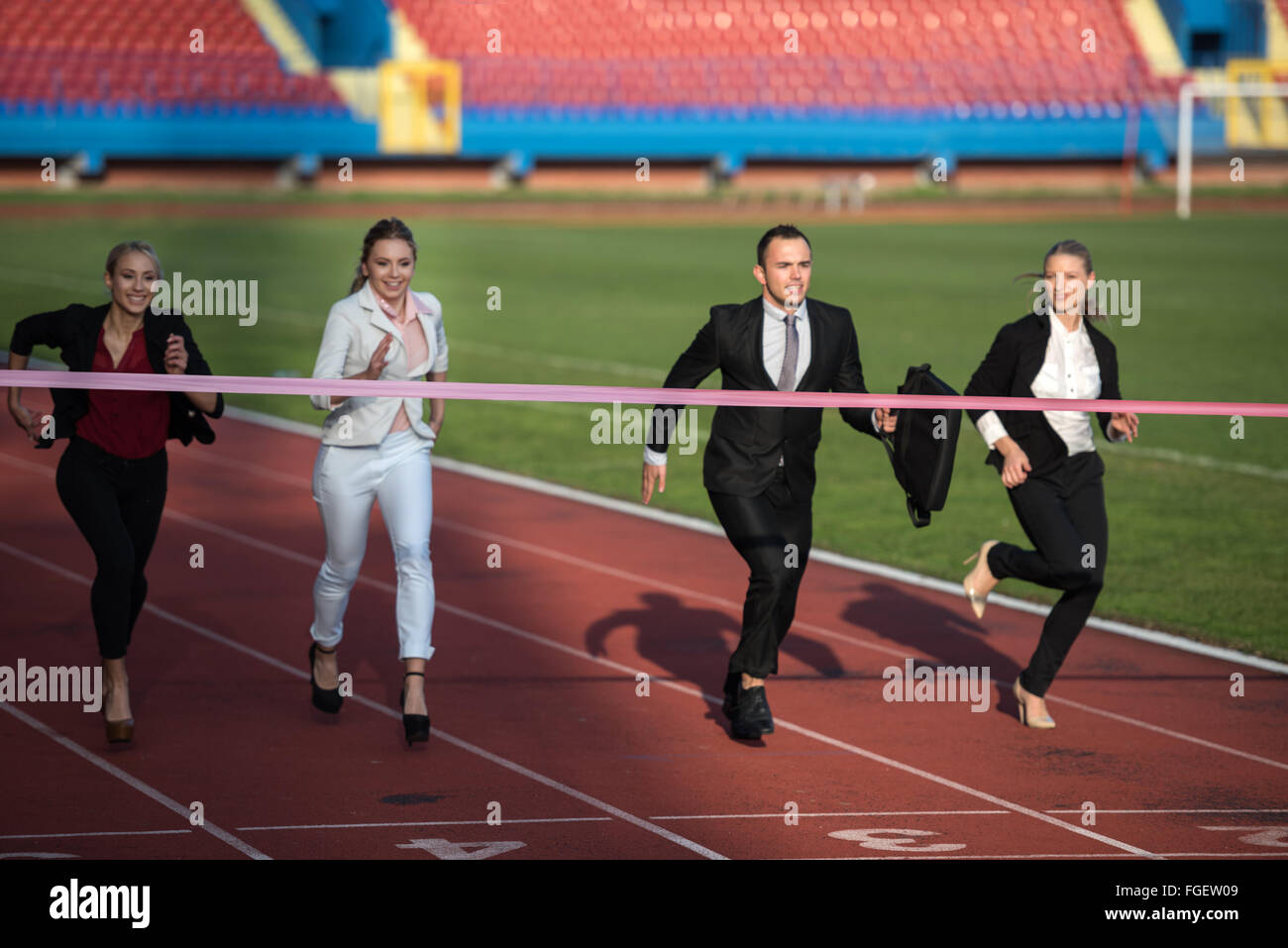 business people running on racing track Stock Photo - Alamy