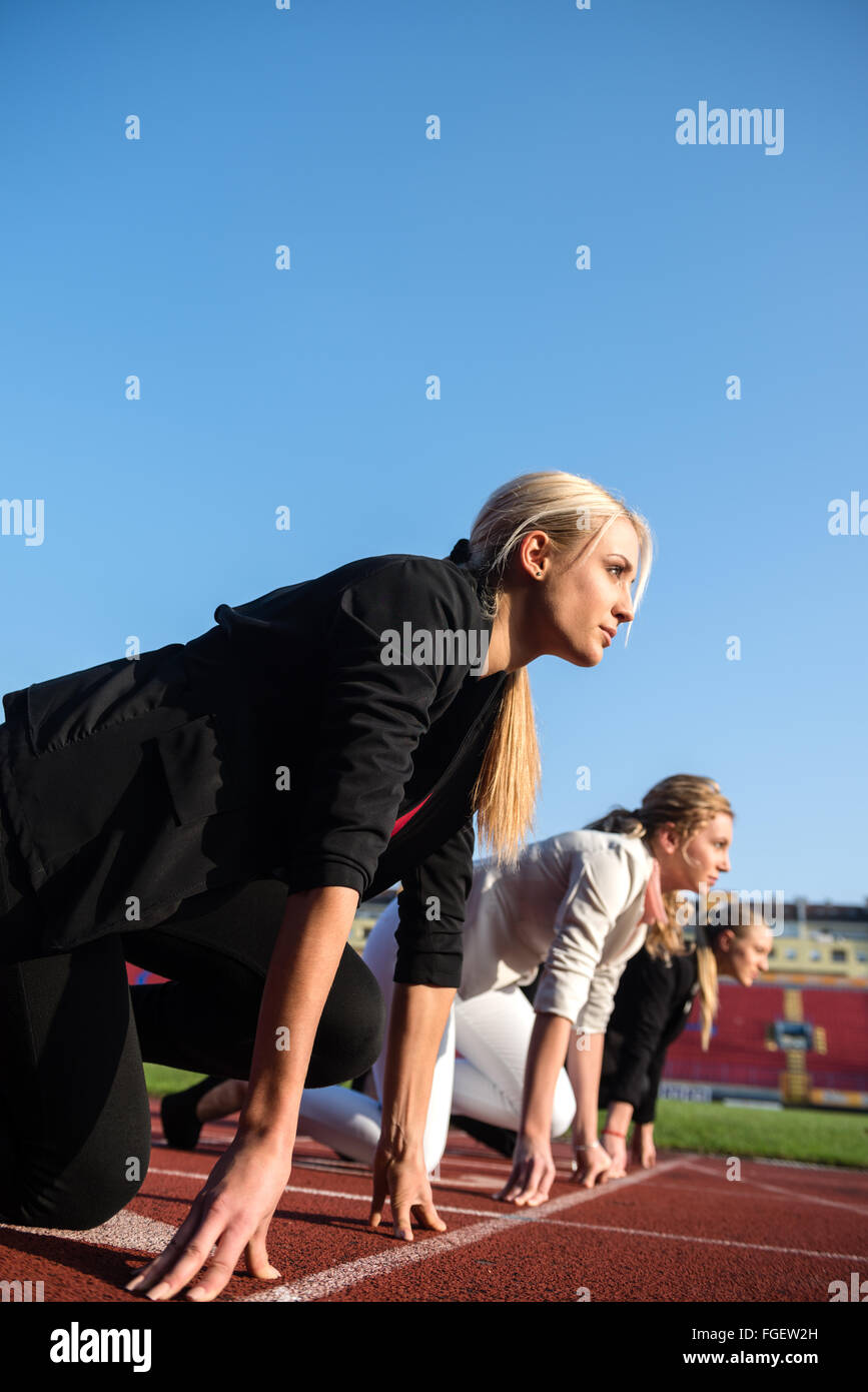 business people running on racing track Stock Photo - Alamy