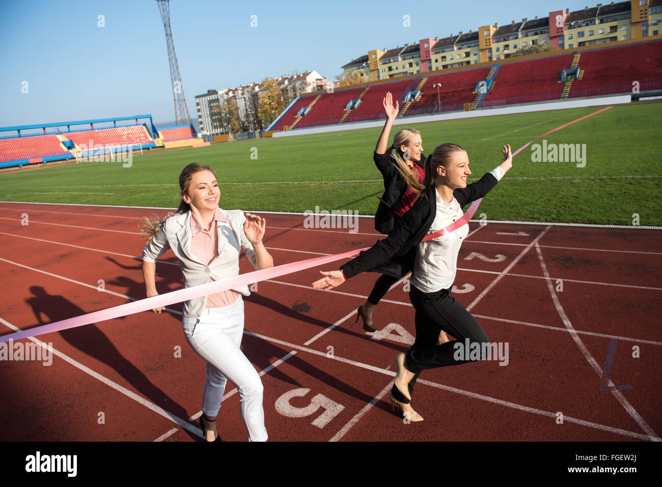 business people running on racing track Stock Photo - Alamy