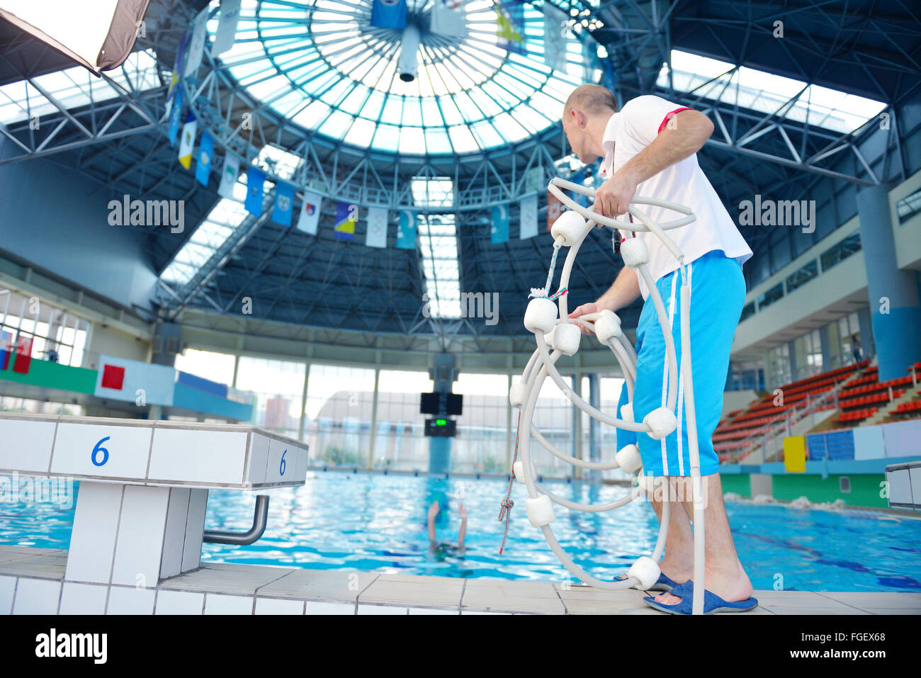 help and rescue on swimming pool Stock Photo - Alamy