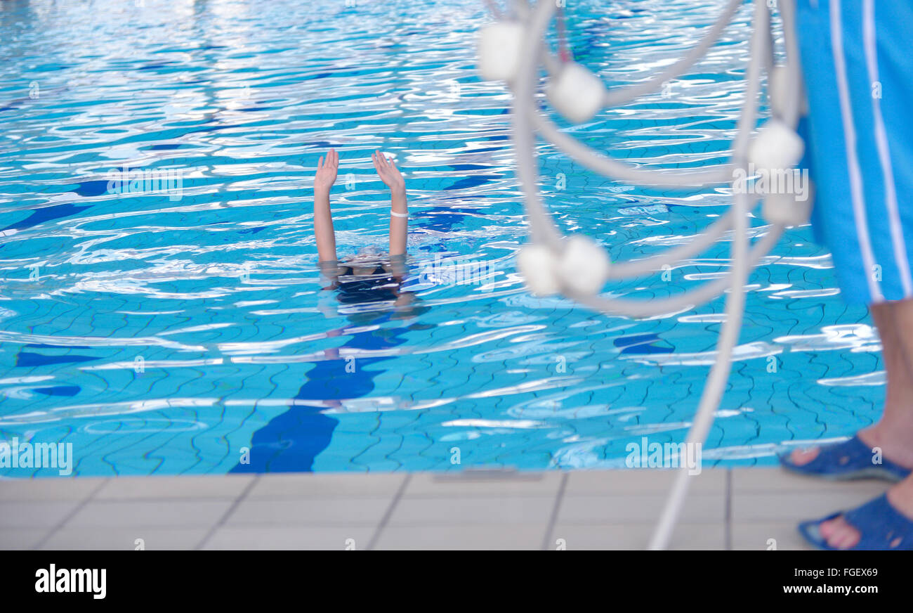 help and rescue on swimming pool Stock Photo - Alamy