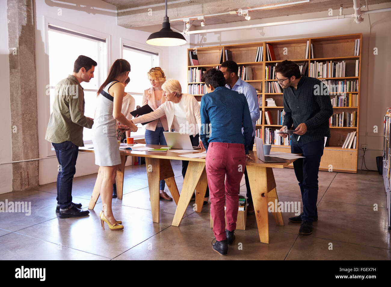 Business Team Meeting Around Table For Brainstorming Session Stock ...