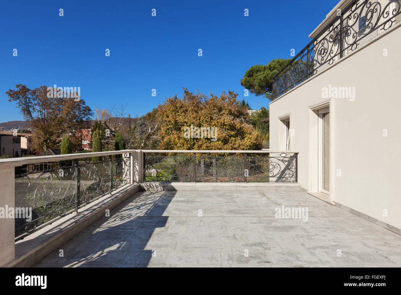sunny terrace of a classical style building, exterior Stock Photo - Alamy