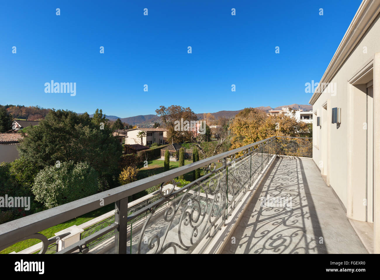 sunny terrace of a classical style building, exterior Stock Photo - Alamy