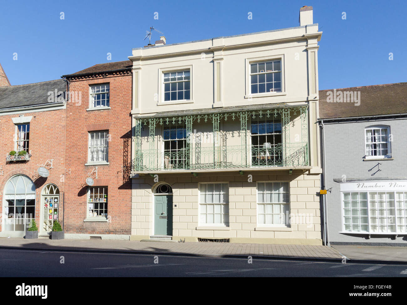 Elegant Georgian building with full width veranda Stock Photo - Alamy