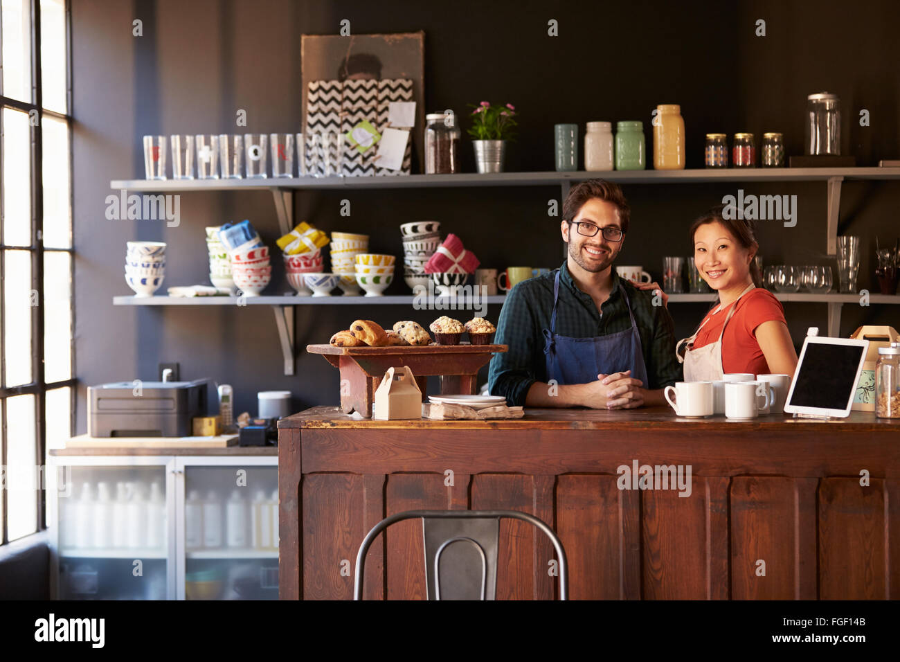 Portrait Of Couple Running Coffee Shop Behind Counter Stock Photo - Alamy