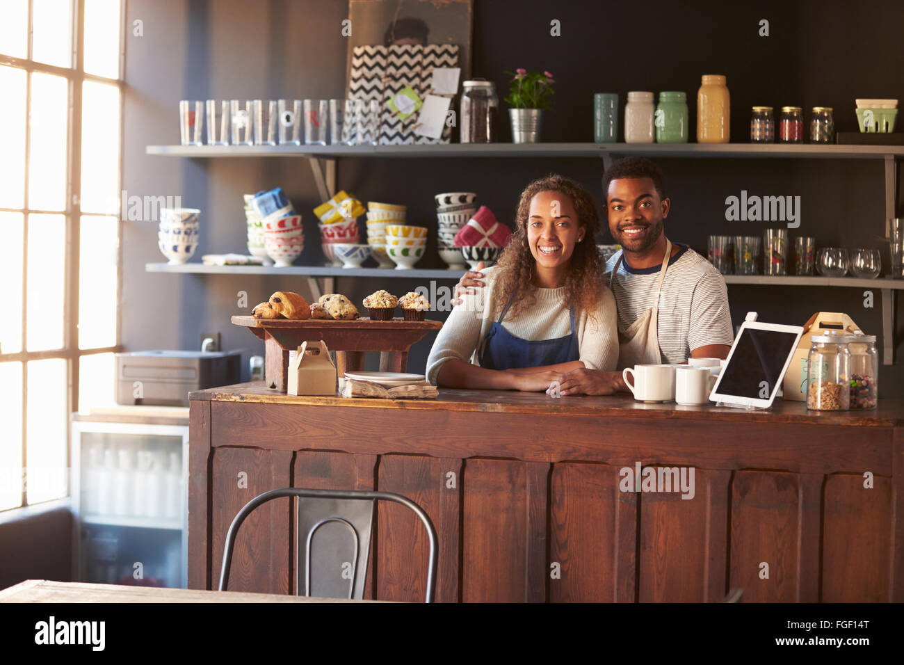 Portrait Of Couple Running Coffee Shop Behind Counter Stock Photo - Alamy