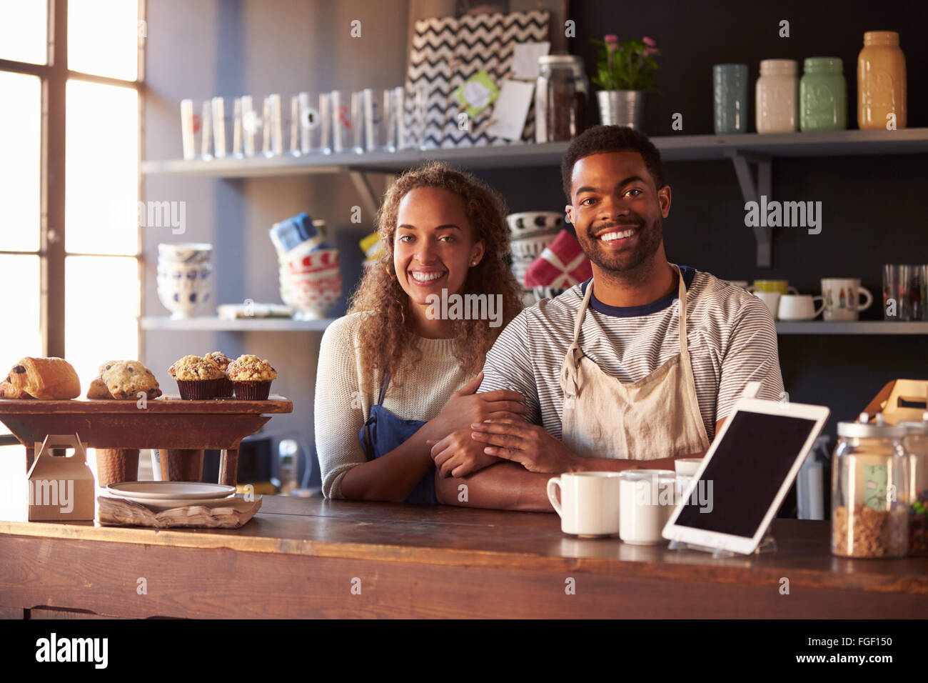 Portrait Of Couple Running Coffee Shop Behind Counter Stock Photo - Alamy