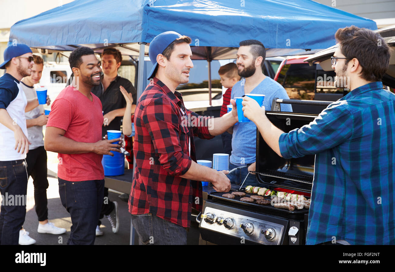 Group Of Sports Fans Tailgating In Stadium Car Park Stock Photo - Alamy