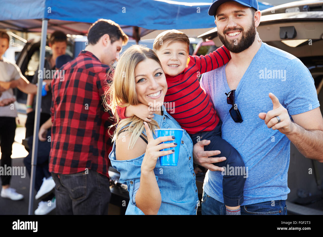 Portrait Of Family Group Tailgating In Stadium Car Park Stock Photo - Alamy
