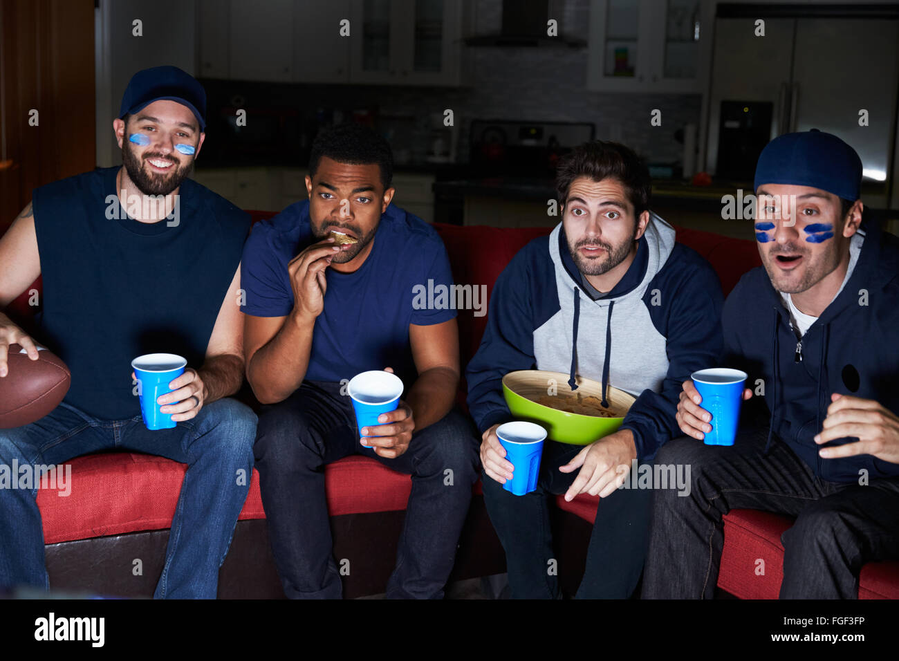 Group Of Male Sports Fans Watching Game On Television Stock Photo - Alamy