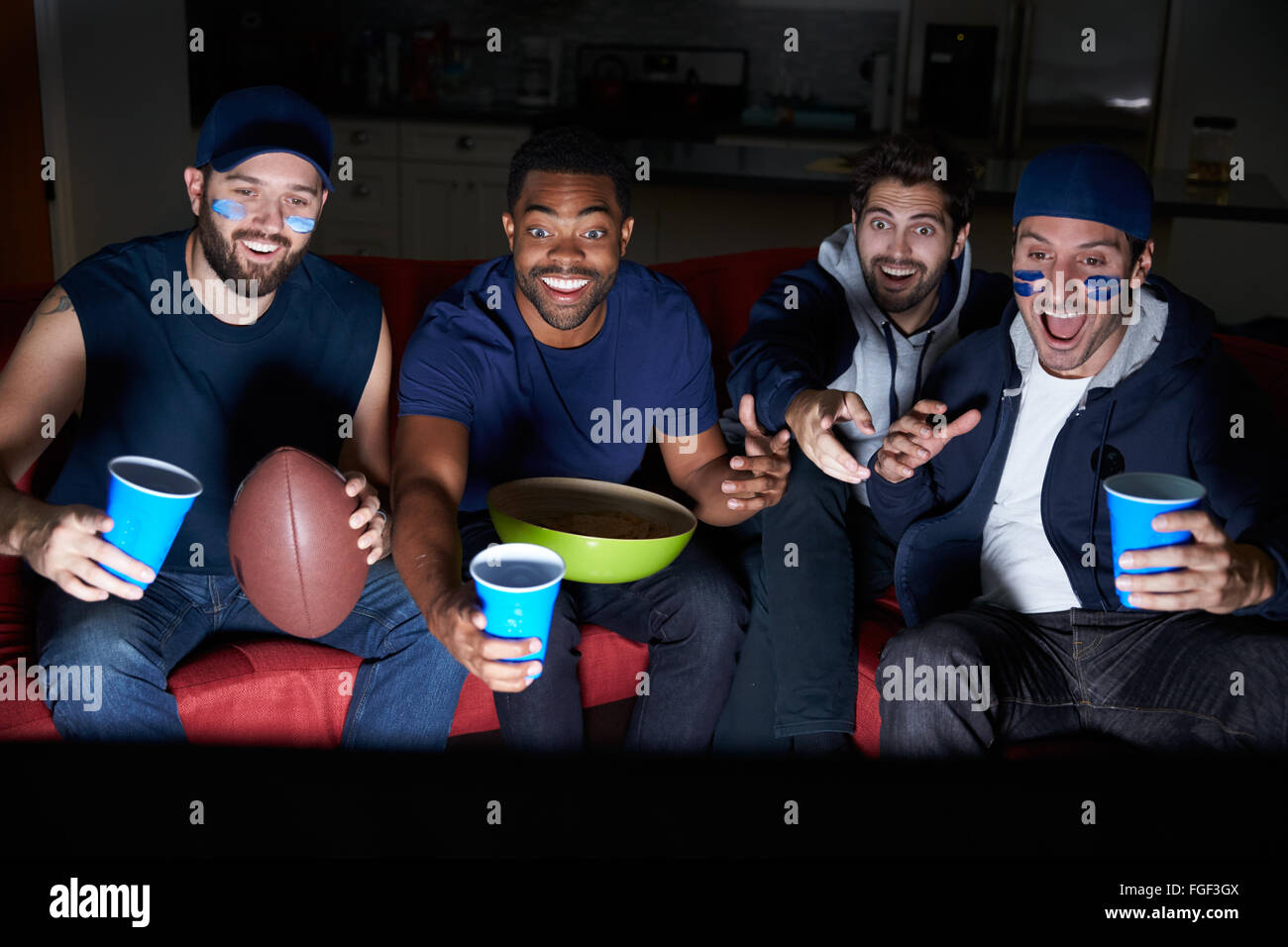 Group Of Male Sports Fans Watching Game On Television Stock Photo - Alamy